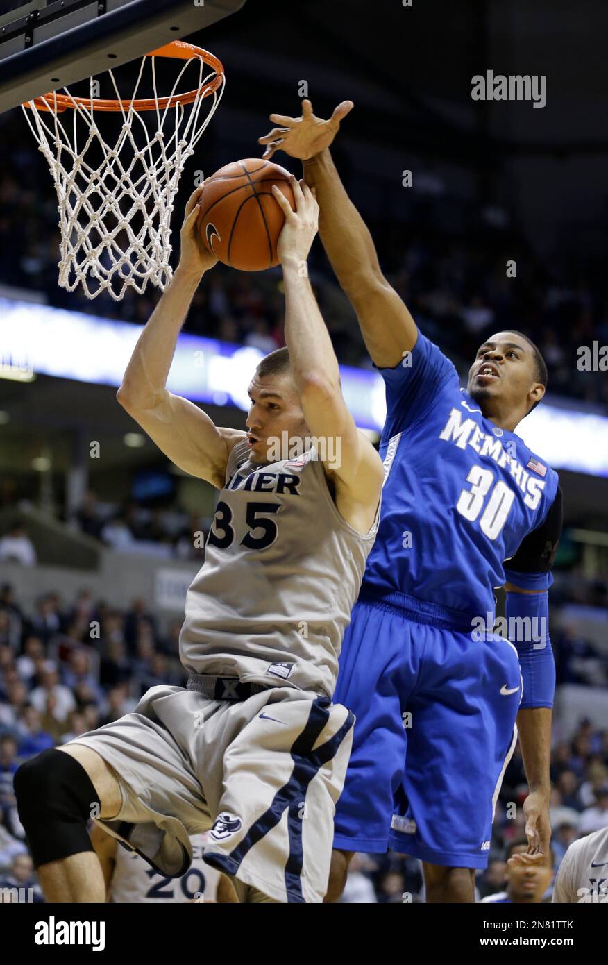 Xavier forward Erik Stenger (35) takes a rebound away from Memphis ...