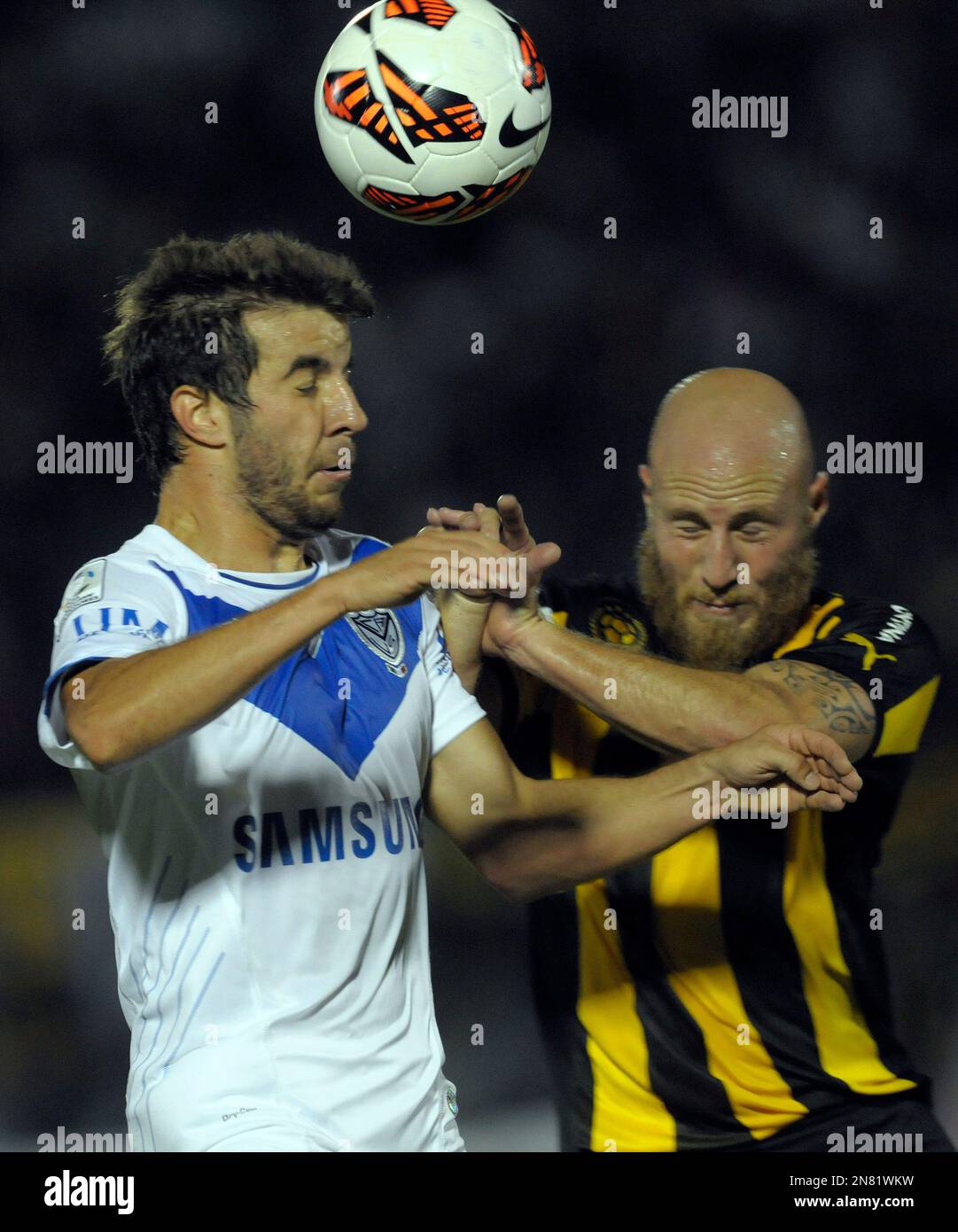 Argentina's Velez Sarsfield's Lucas Pratto, left, and Uruguay's Penarol ...