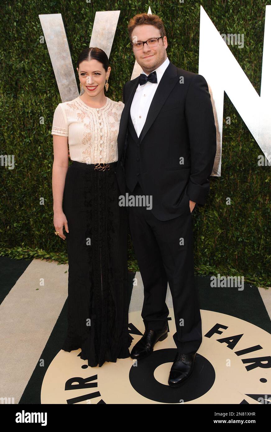 From left, Lauren Miller and actor Seth Rogen arrive at the 2013 Vanity ...