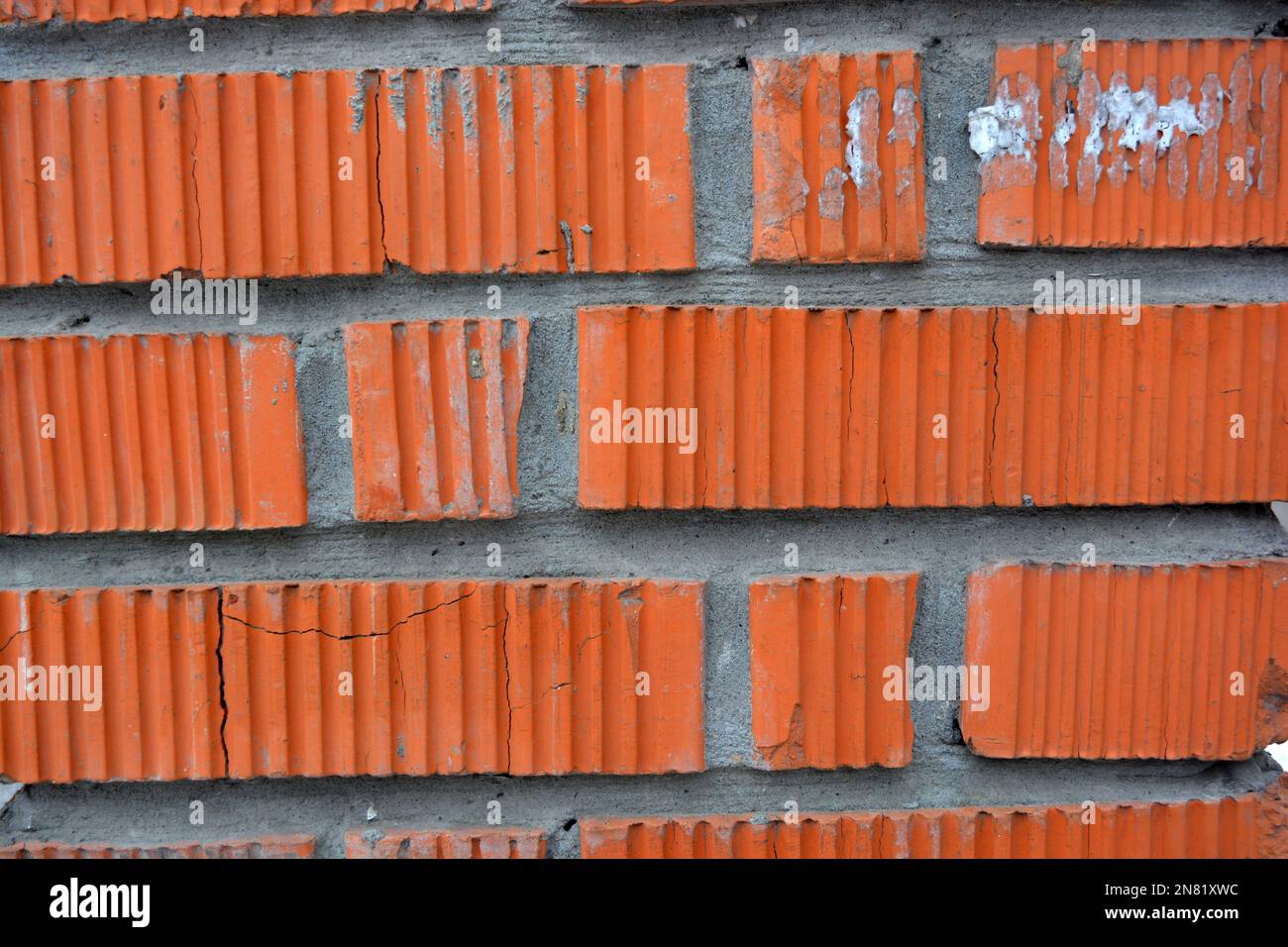 Building background, red beautiful brick wall with grooved sides ...