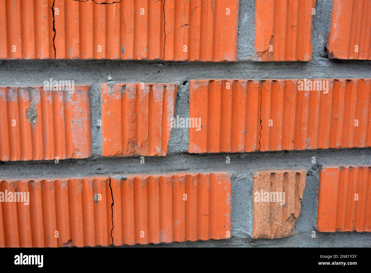 Building background, red beautiful brick wall with grooved sides ...