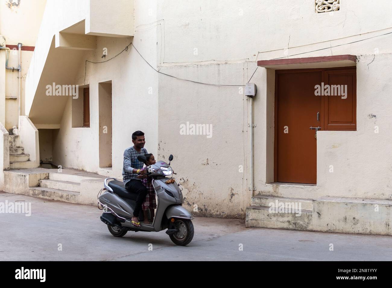 Indian man riding a scooter hi-res stock photography and images - Alamy