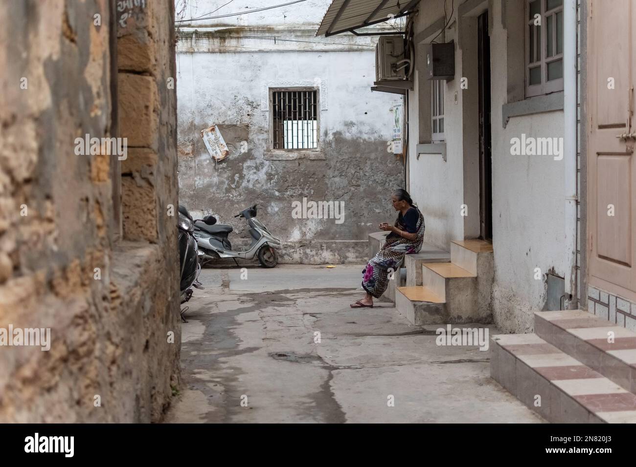 Diu, India - December 2018: An alley lined with old houses in a ...