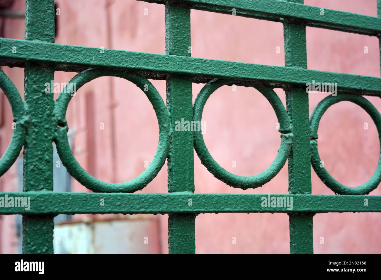 An old Soviet metal fence welded with an interesting shape, arrows and ...