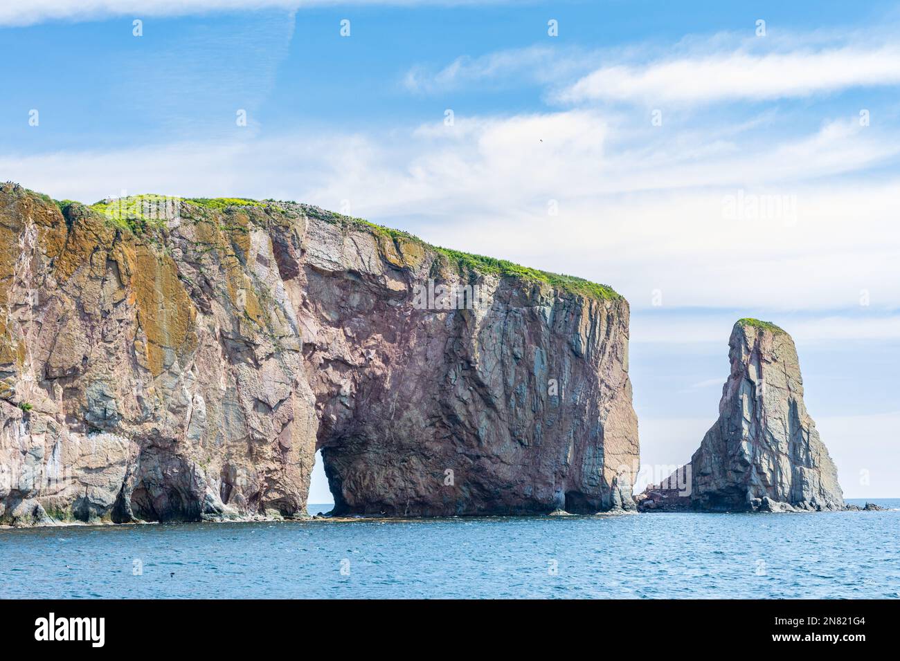 View of Percé Rock, a huge sheer rock formation in the Gulf of Saint ...