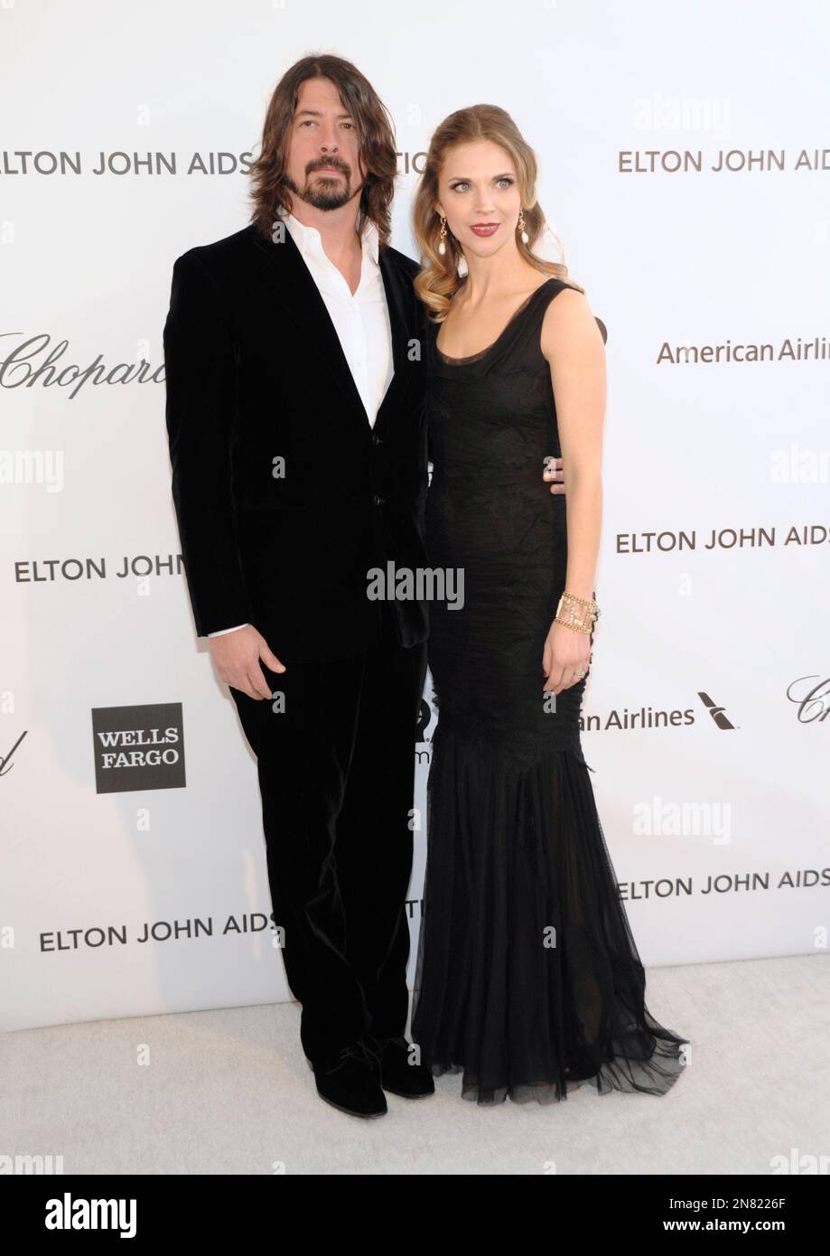Singer Dave Grohl, left, and his wife Jordyn Blum arrive at the 2013 ...