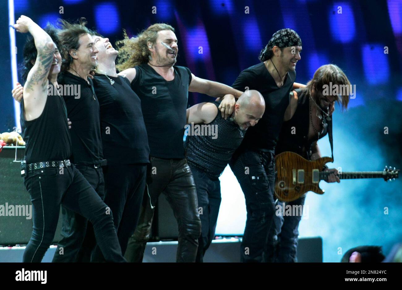 Mexican rock band Mana and other musicians bow farewell to the audience ...
