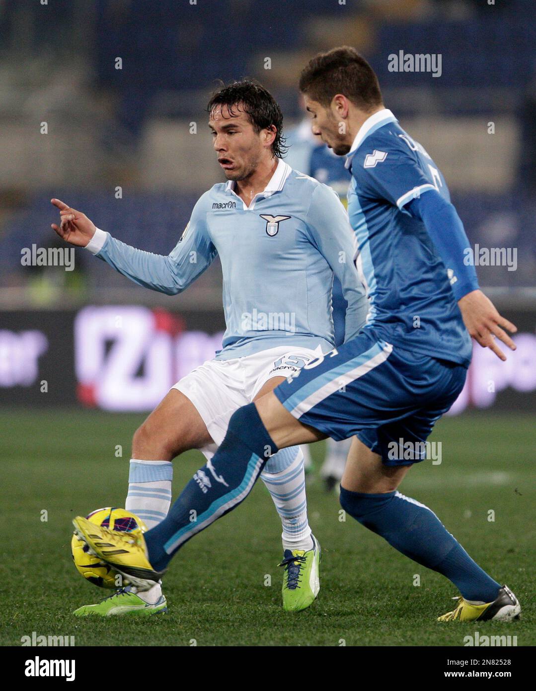 Lazio midfielder Alvaro Gonzalez, of Uruguay, is challenged by Pescara ...