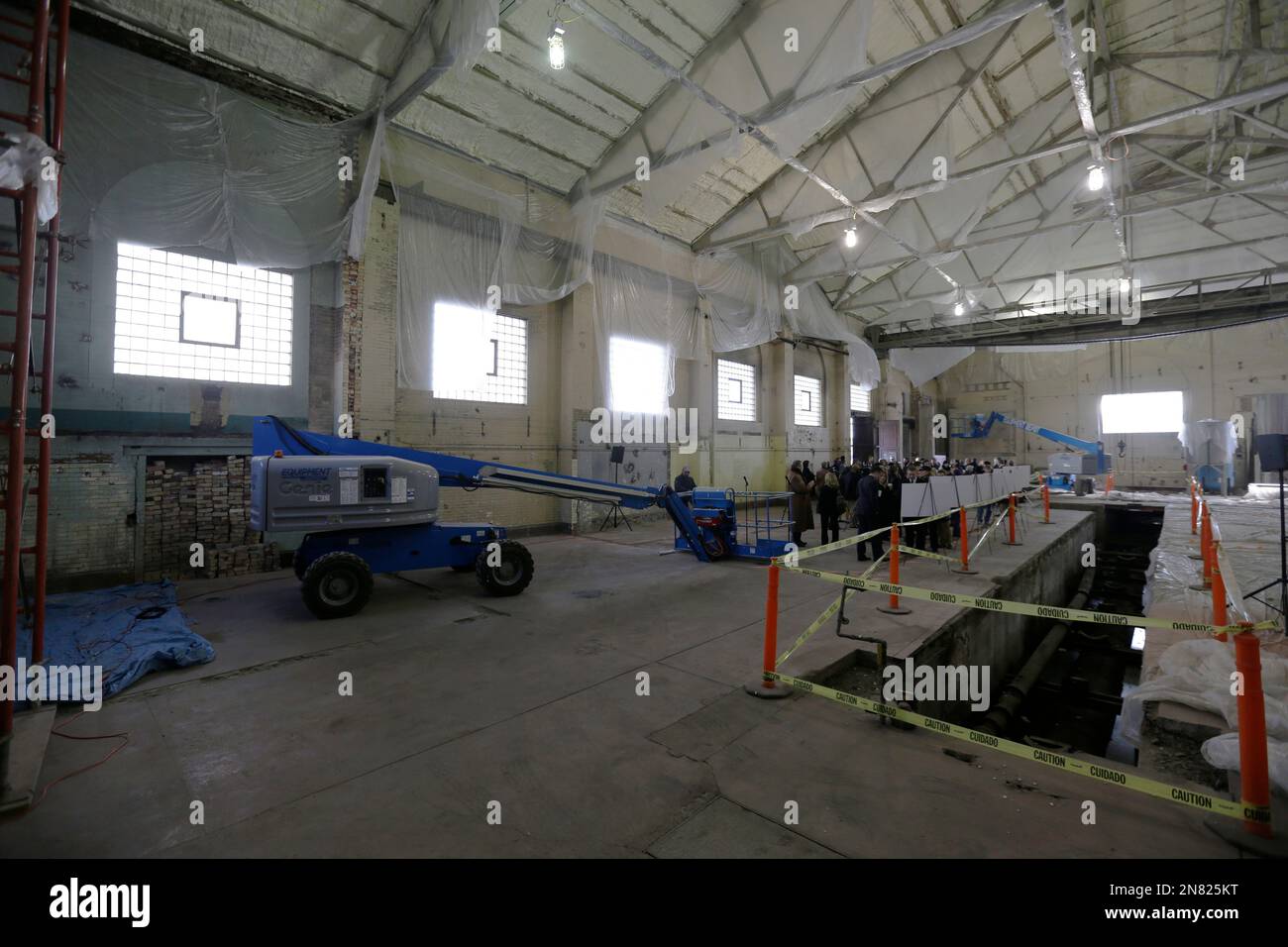 An interior view is seen of a historic pumping station at the base of ...