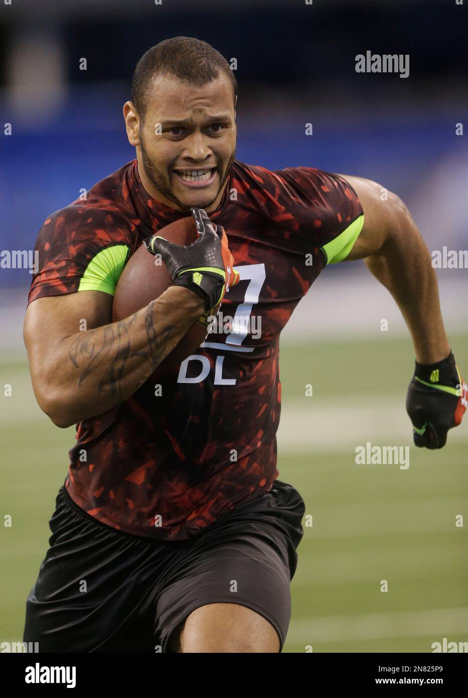 Harding defensive lineman Ty Powell runs a drill during the NFL ...