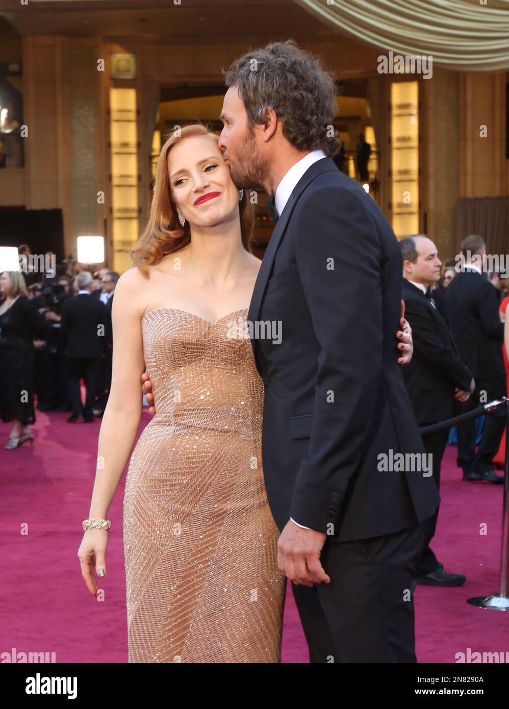 Actor Jason Clarke, right, kisses actress Jessica Chastain as they ...