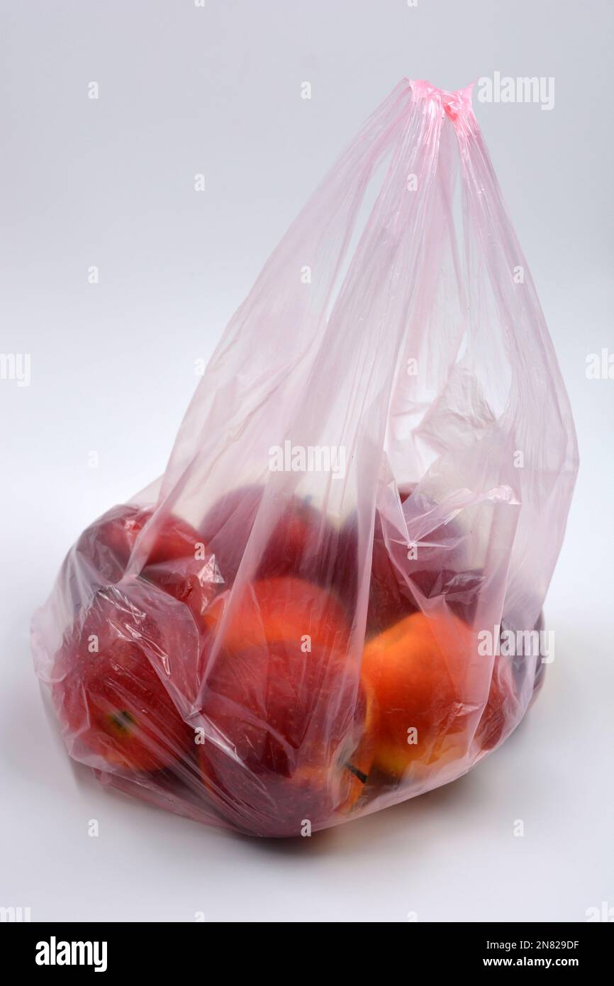 A large package of fruit, healthy food, a lot of red, ripe apples lie ...