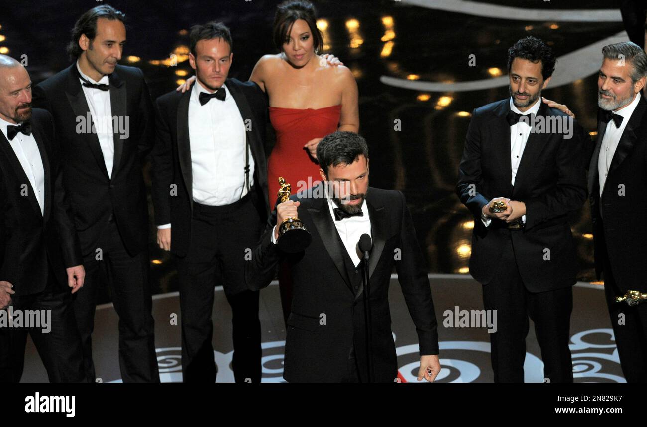 Director/producer Ben Affleck, center, accepts the award for best ...