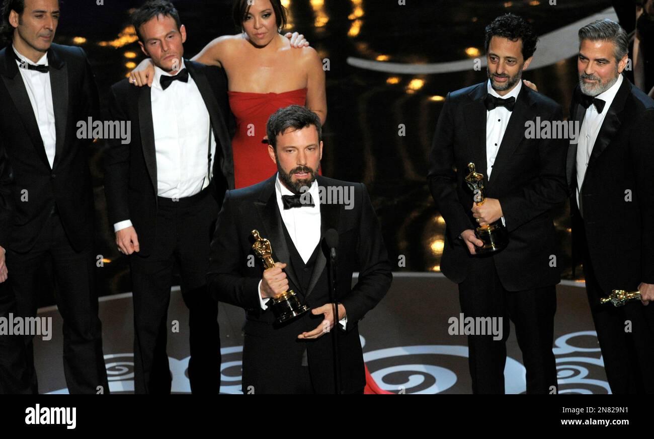 Director/producer Ben Affleck, center, accepts the award for best ...