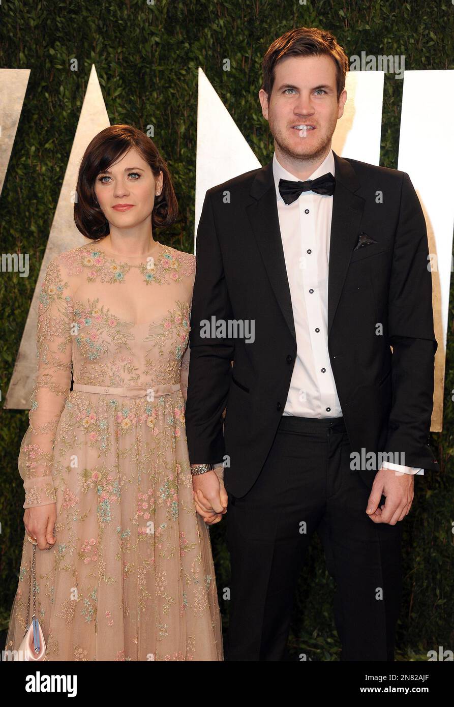 From left, actress Zooey Deschanel and writer Jamie Linden arrive at ...