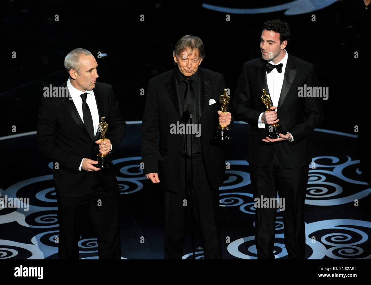 From left, Simon Hayes, Andy Nelson and Mark Paterson accept the award ...