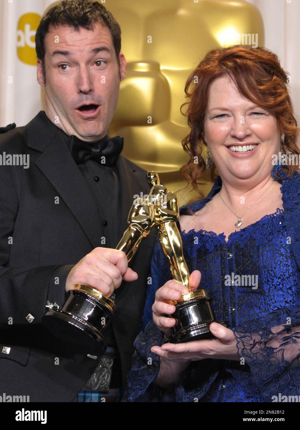 Directors Mark Andrews, left, and Brenda Chapmanpose with their award ...