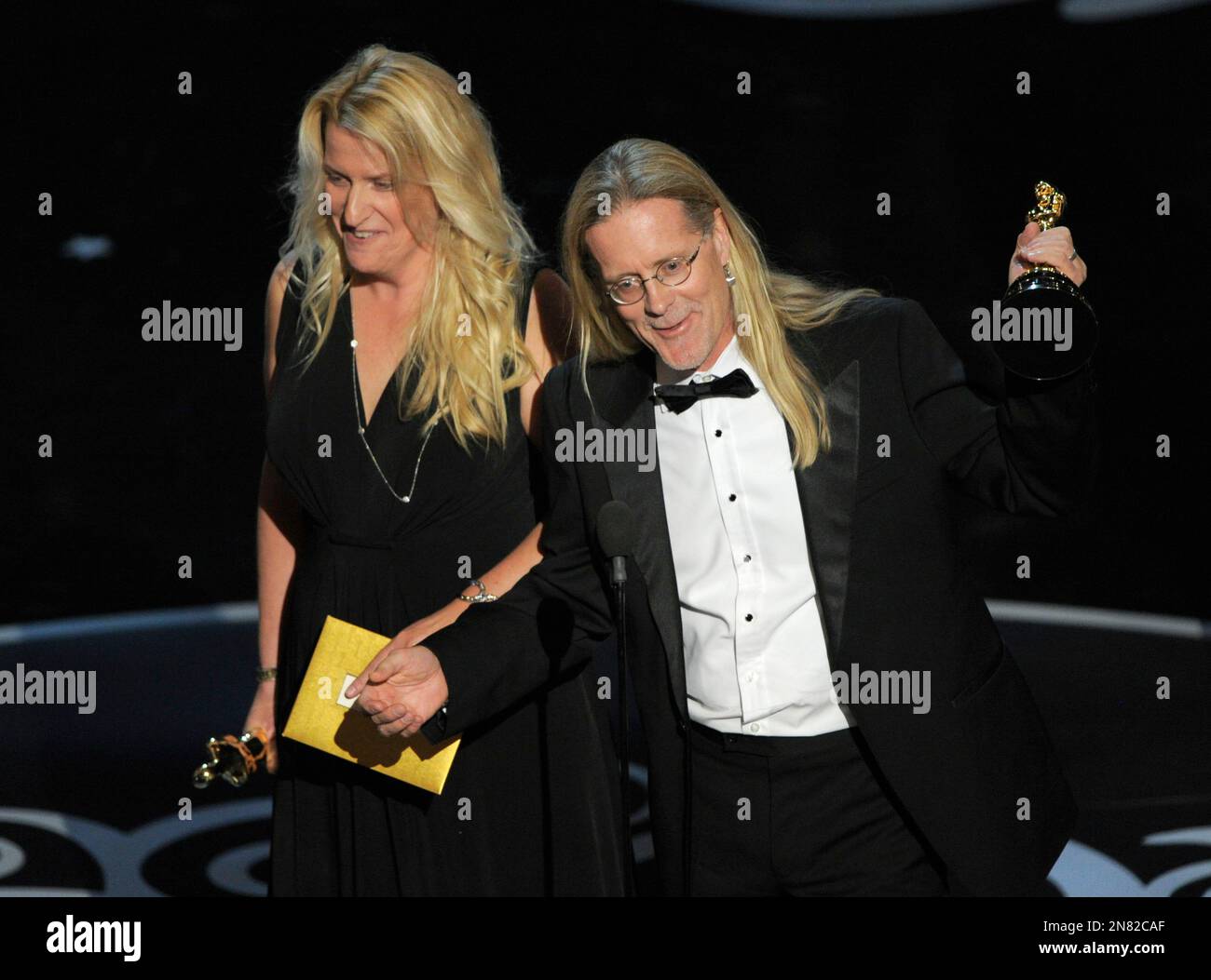 Karen Baker Landers, left, and Per Hallberg accept the award for best ...