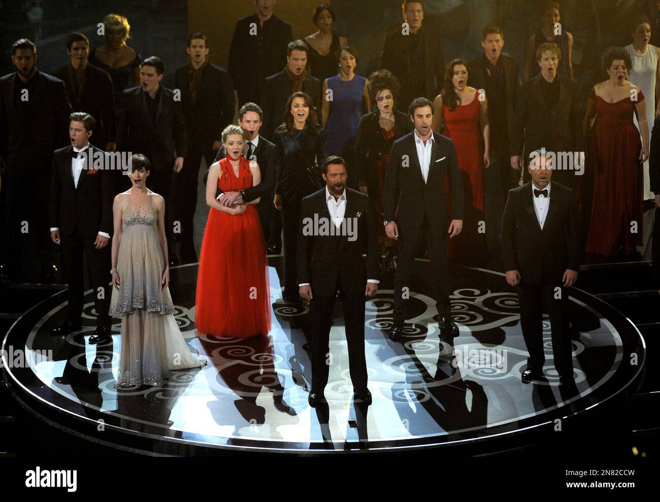From left, actors Aaron Tveit, Anne Hathaway, Amanda Seyfried, Eddie ...