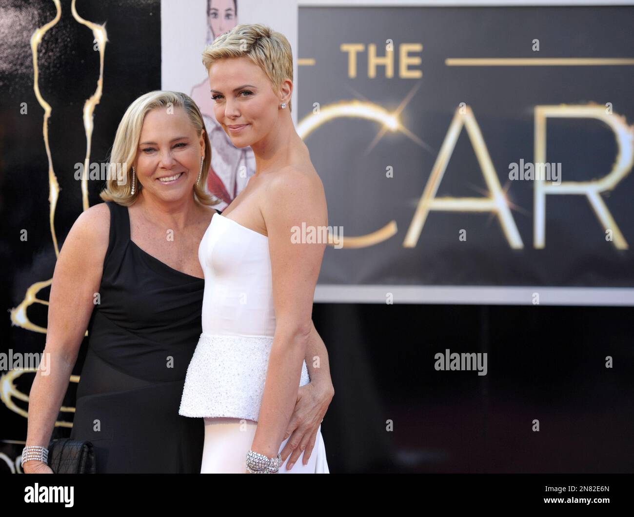 Actress Charlize Theron, right, and Gerda Jacoba Aletta Maritz arrive ...