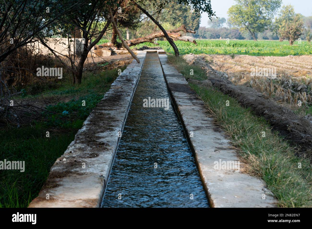 Water canal for crop field irrigation system in the village Stock Photo ...