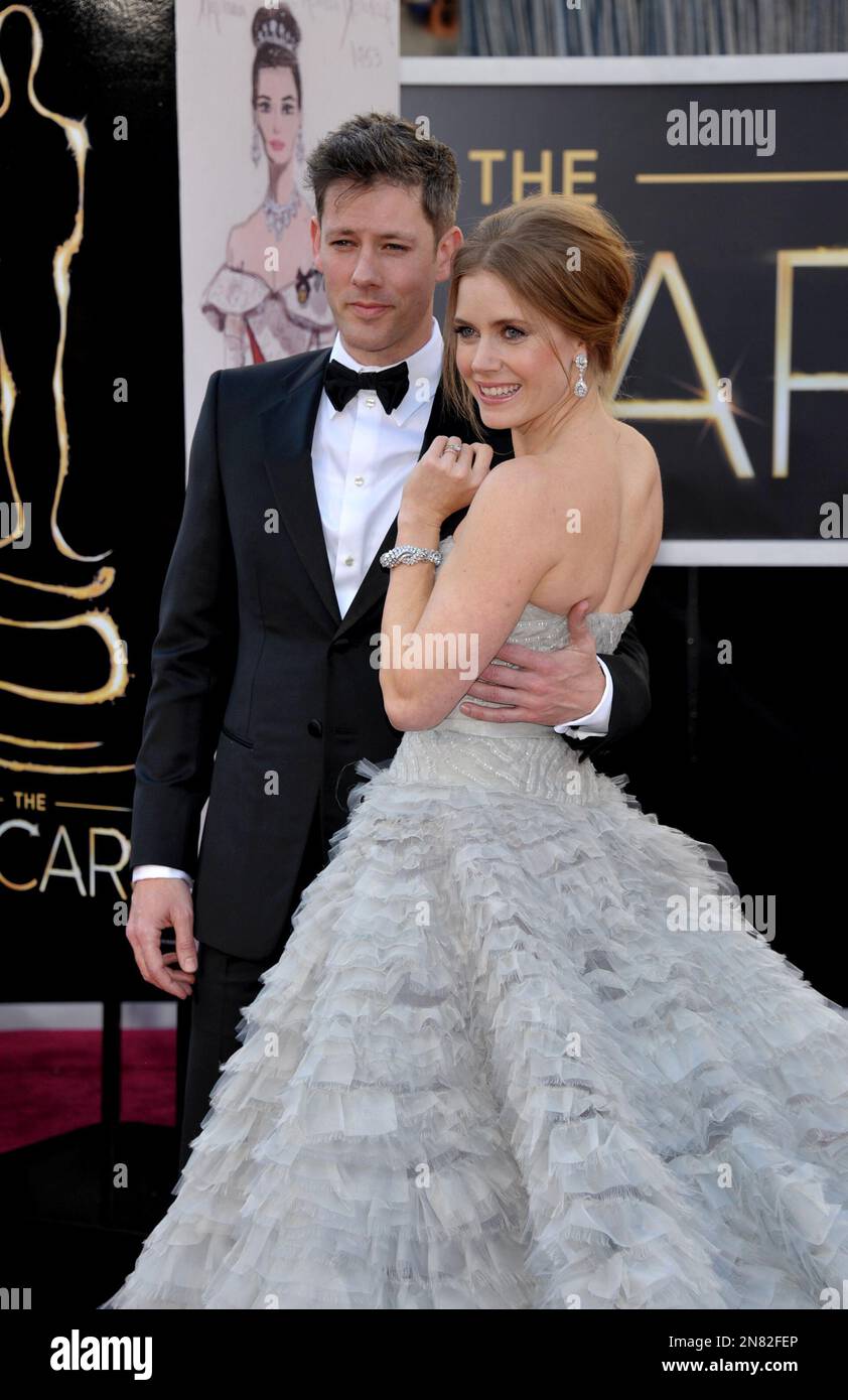 Actors Darren Le Gallo, left, and Amy Adams arrive at the 85th Academy ...