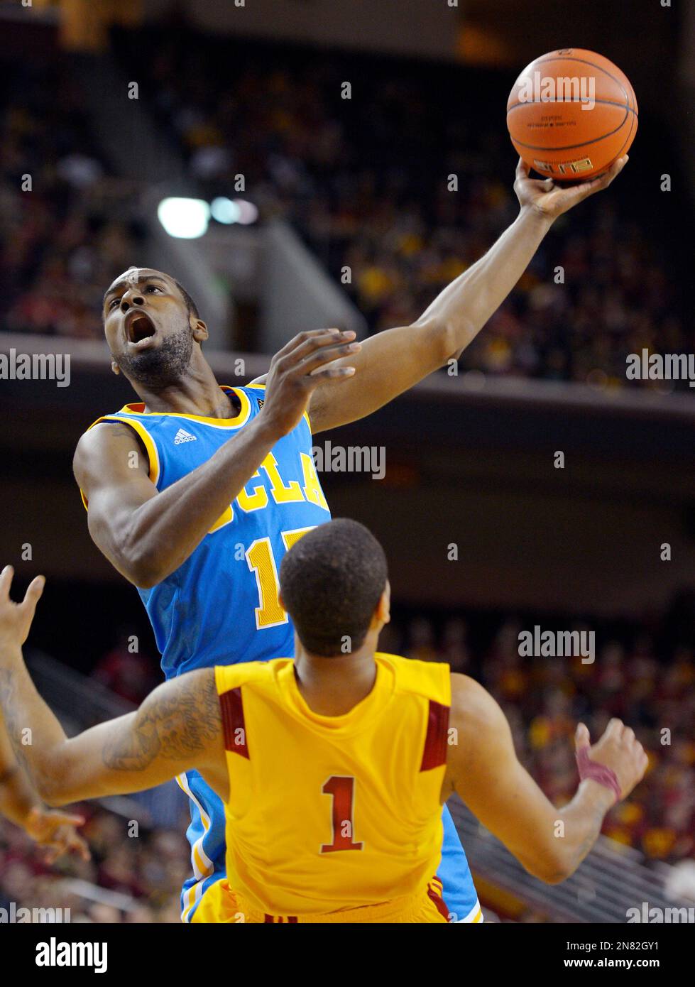 UCLA forward Shabazz Muhammad, top, shoots as Southern California guard ...
