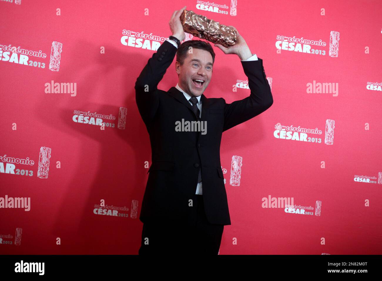 French actor Guillaume de Tonquedec holds his Best Supporting Actor ...