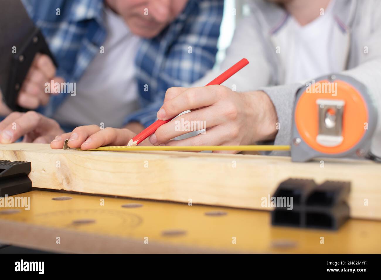 carpenter with pencil and folding rule Stock Photo - Alamy