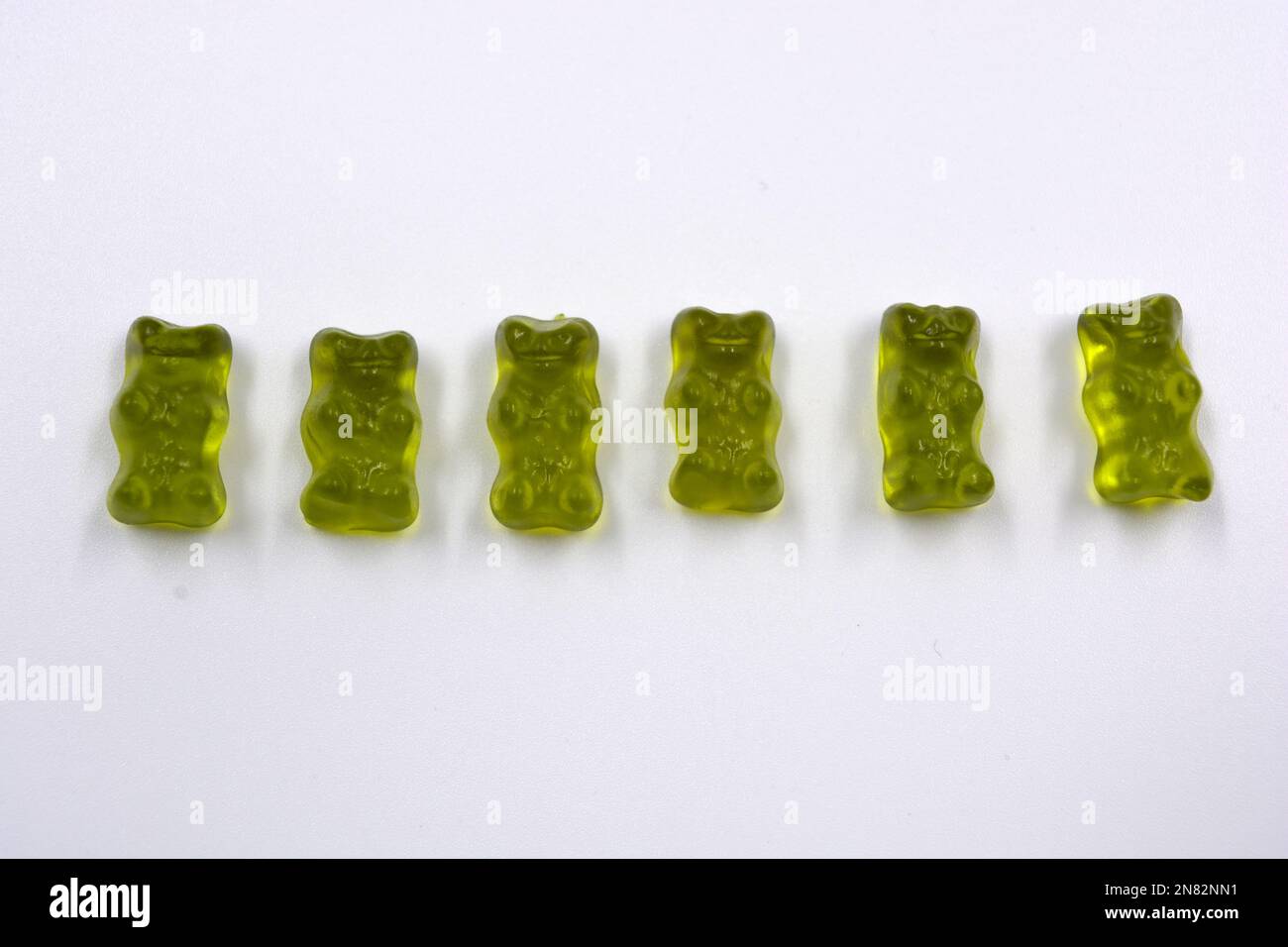 Bright children's green chewing, jelly candies in the form and in the ...