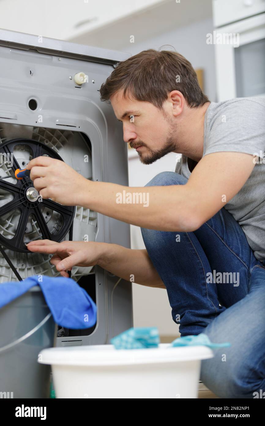 Fixing interior washing machine hi-res stock photography and images - Alamy