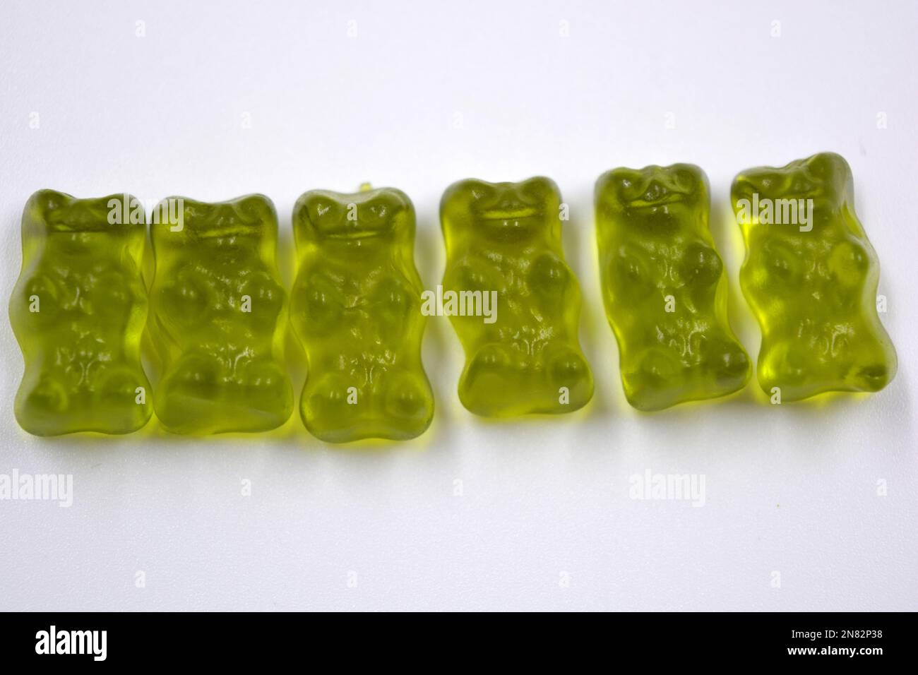 Bright children's green chewing, jelly candies in the form and in the ...