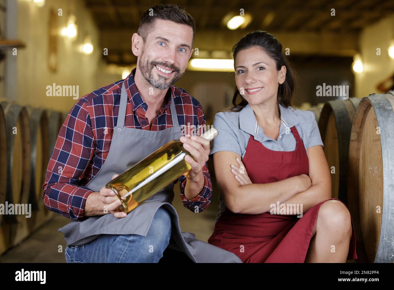 happy professional sommeliers in a winery cellar Stock Photo - Alamy
