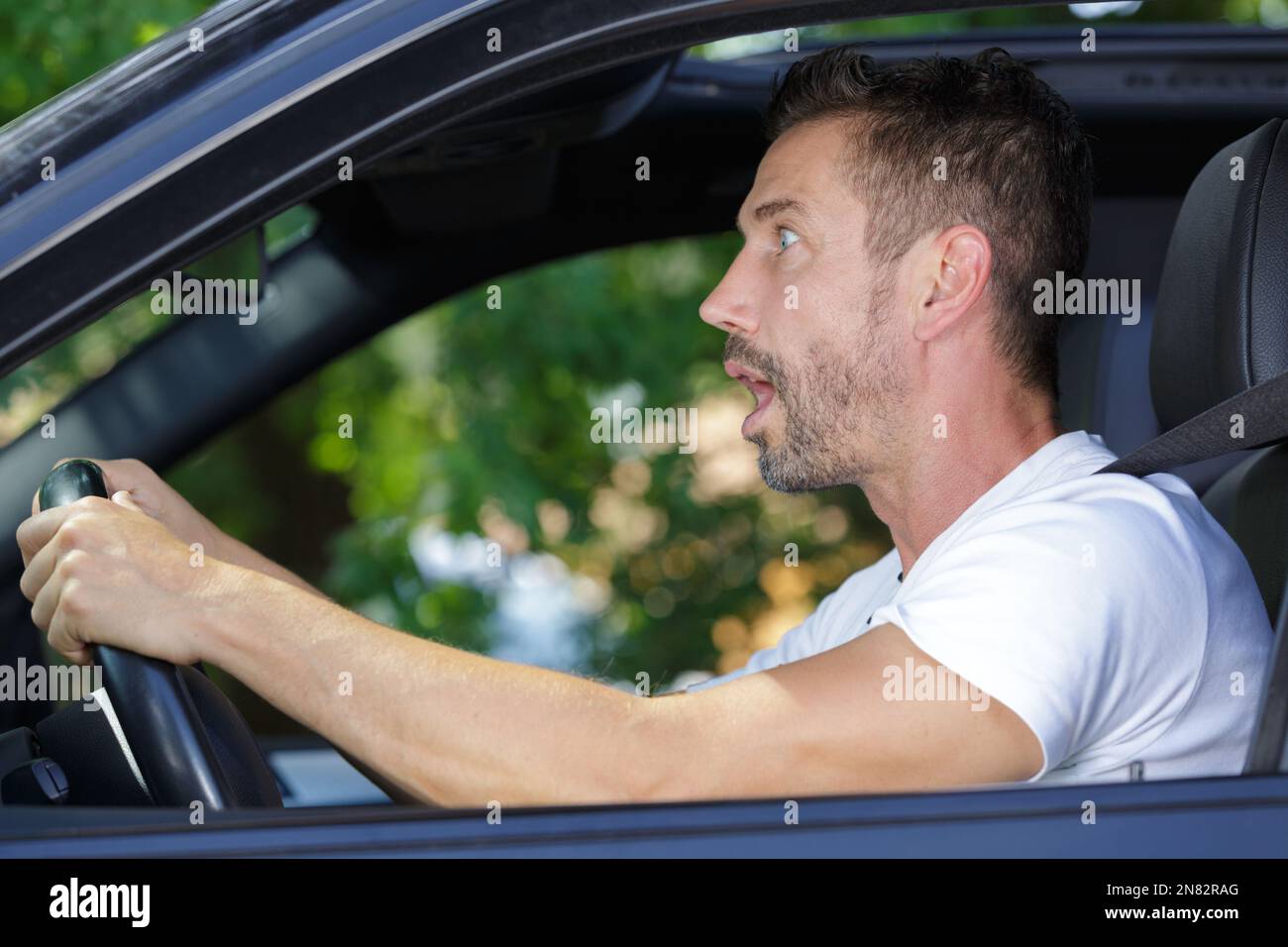 man shocked accident while driving a car Stock Photo - Alamy
