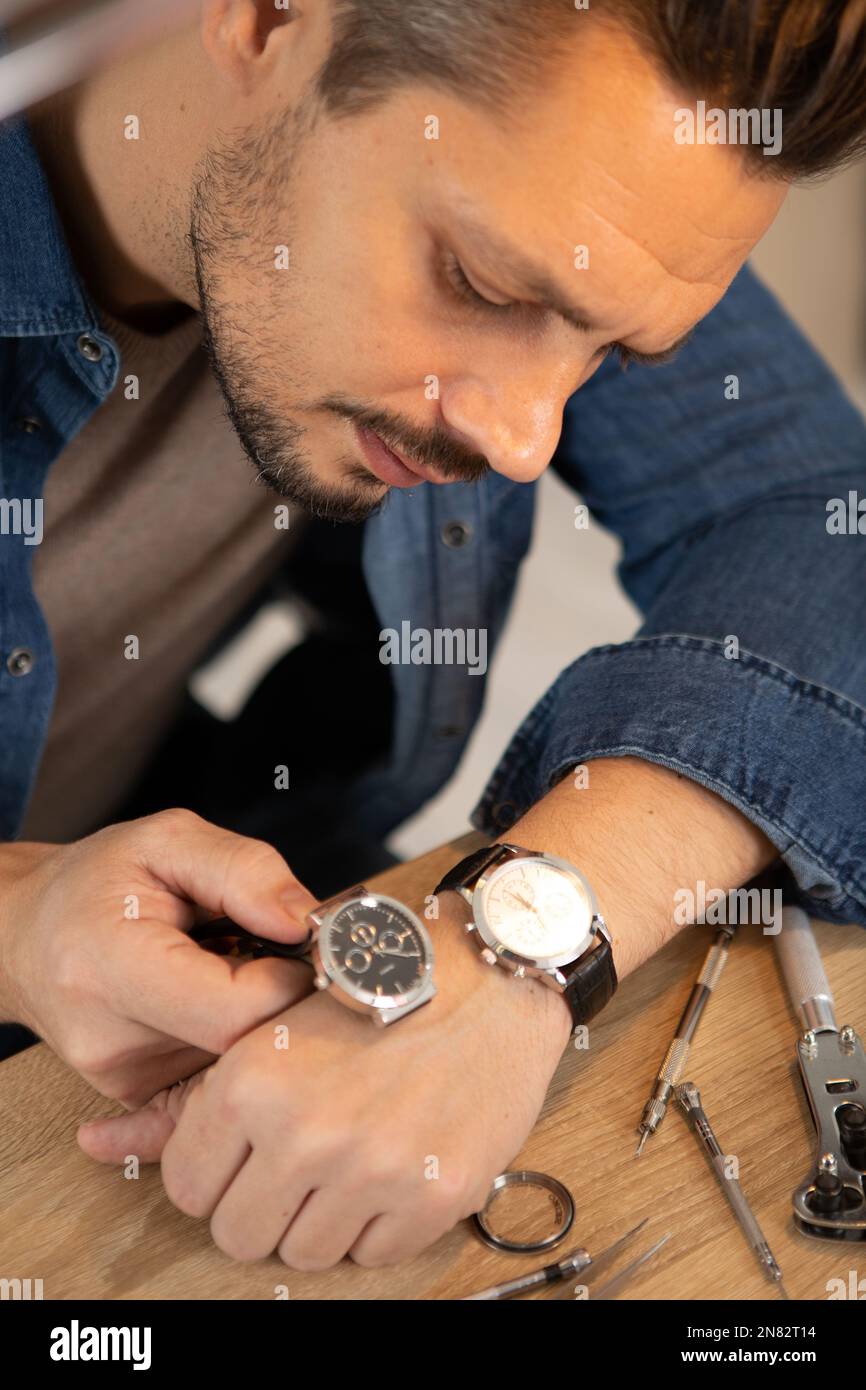 professional clockmaker repairing a watch Stock Photo - Alamy