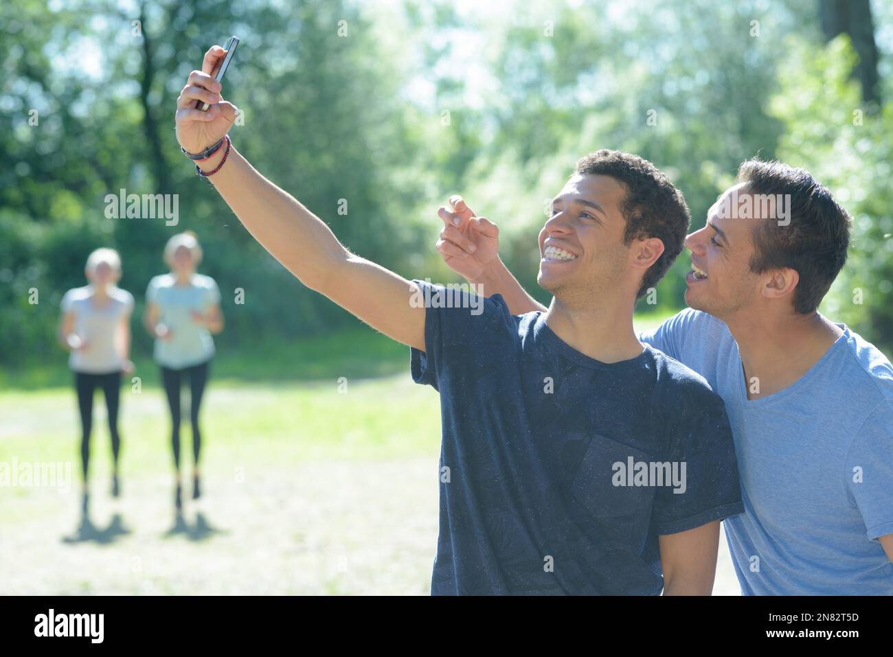 Young man making playful gesture hi-res stock photography and images ...