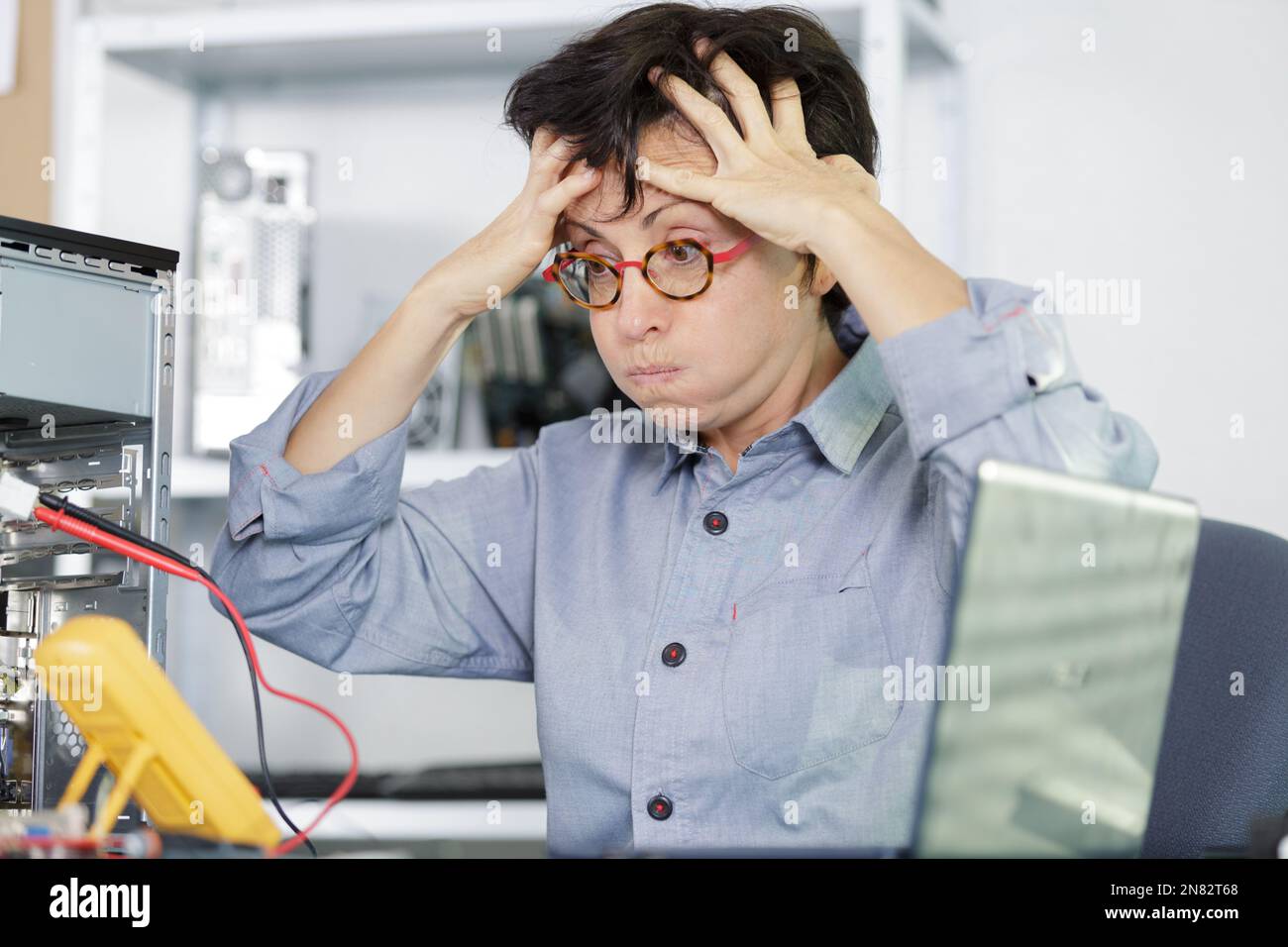 portrait of engineer stress holding his head Stock Photo - Alamy