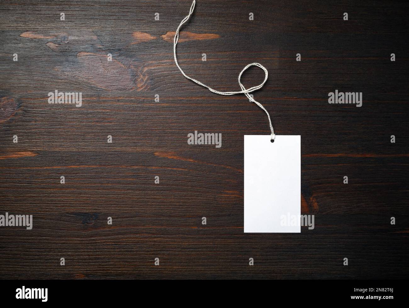 Blank price tag mockup on wood table background. Template for graphic ...