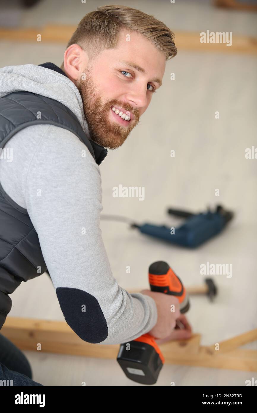 carpenter using cordless screwdriver Stock Photo - Alamy