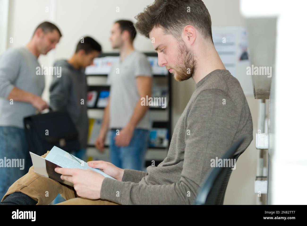 Seated male youth study hi-res stock photography and images - Alamy