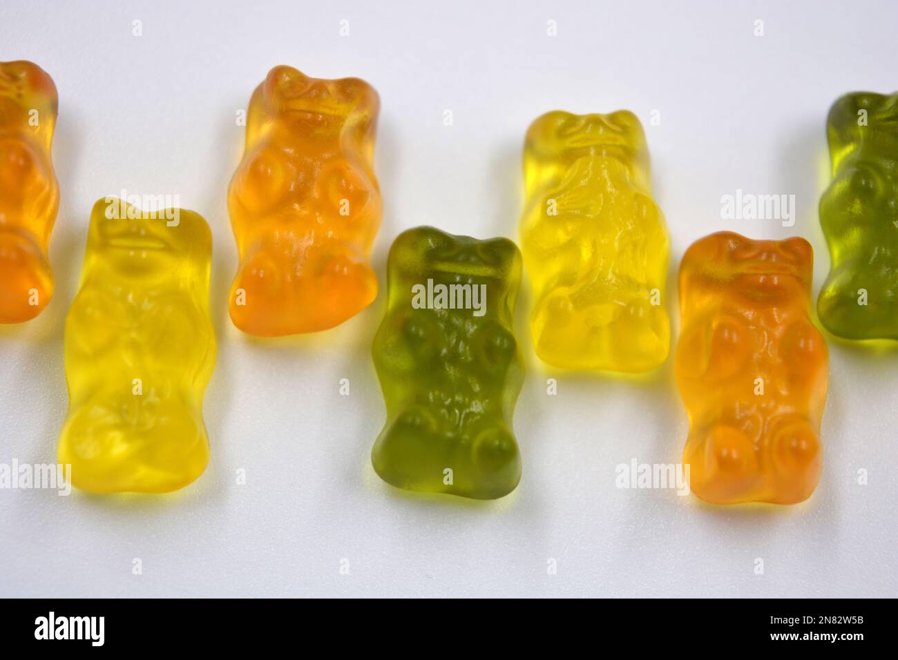 Bright children's orange, green, yellow chewing, jelly candies in the ...