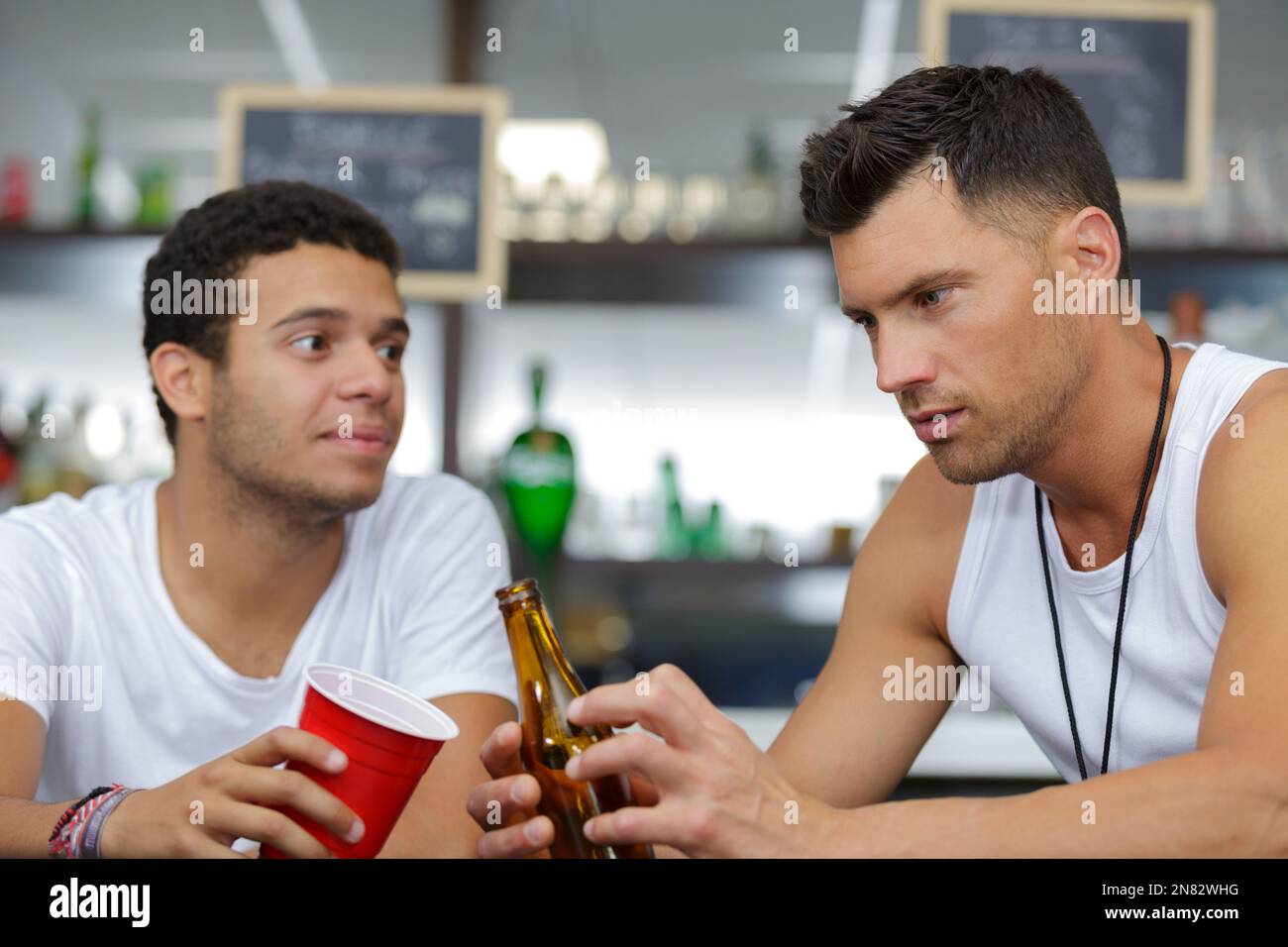 having a drink after sport Stock Photo - Alamy