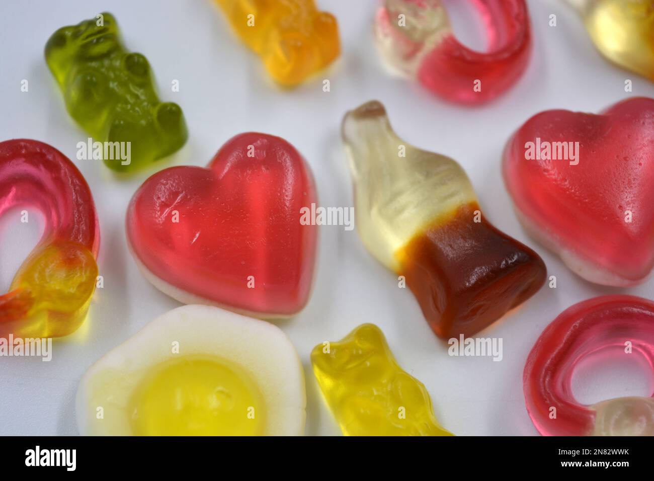 Fried scrambled eggs, a bottle of cola, colored bears, rings with ...