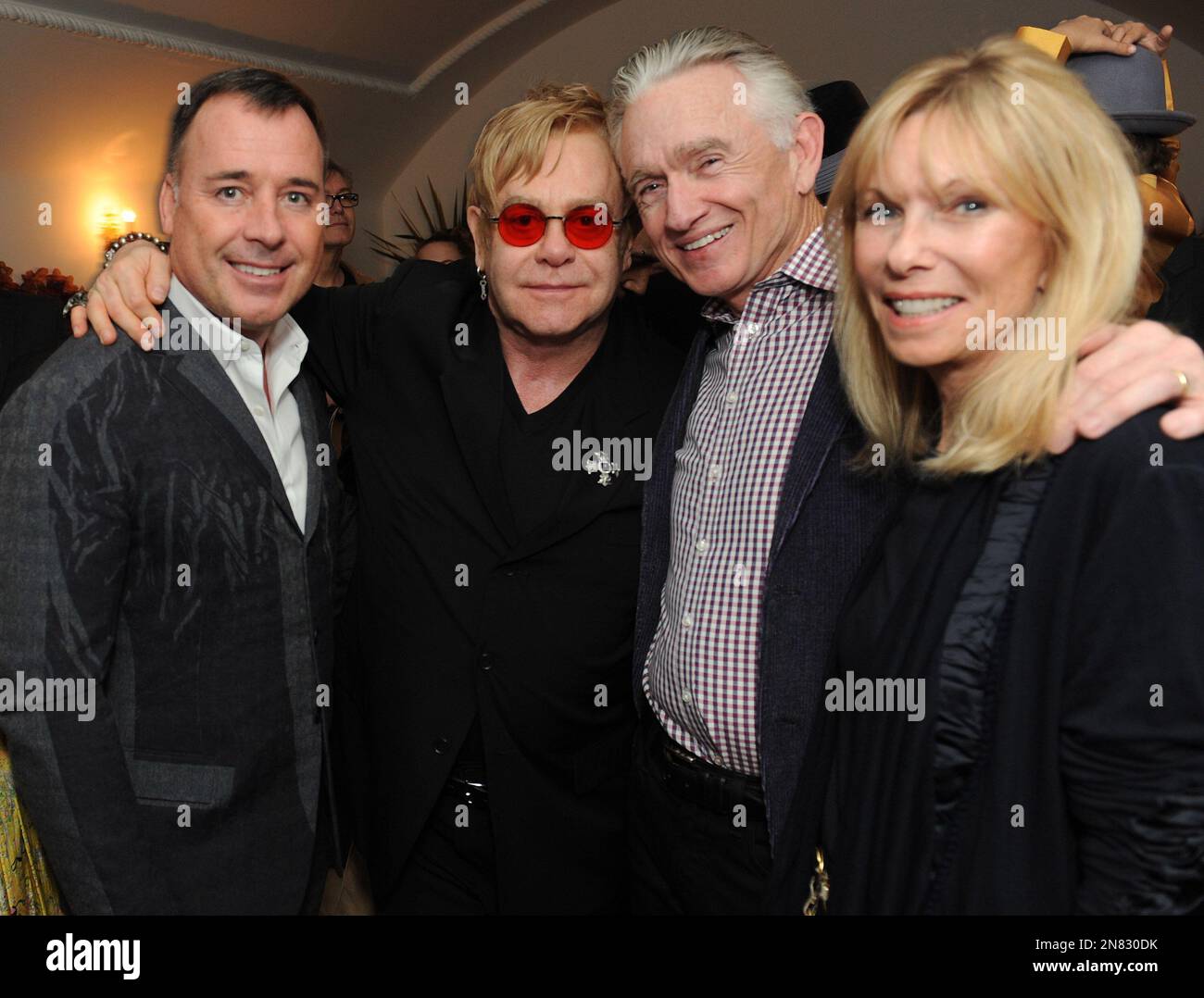 From left, David Furnish, Elton John, Ian Telfer and Nancy Burke attend ...