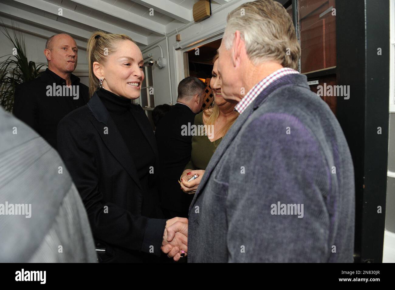 From left, Ian Telfer, Nancy Burke and Sharon Stone attend LoveGold ...