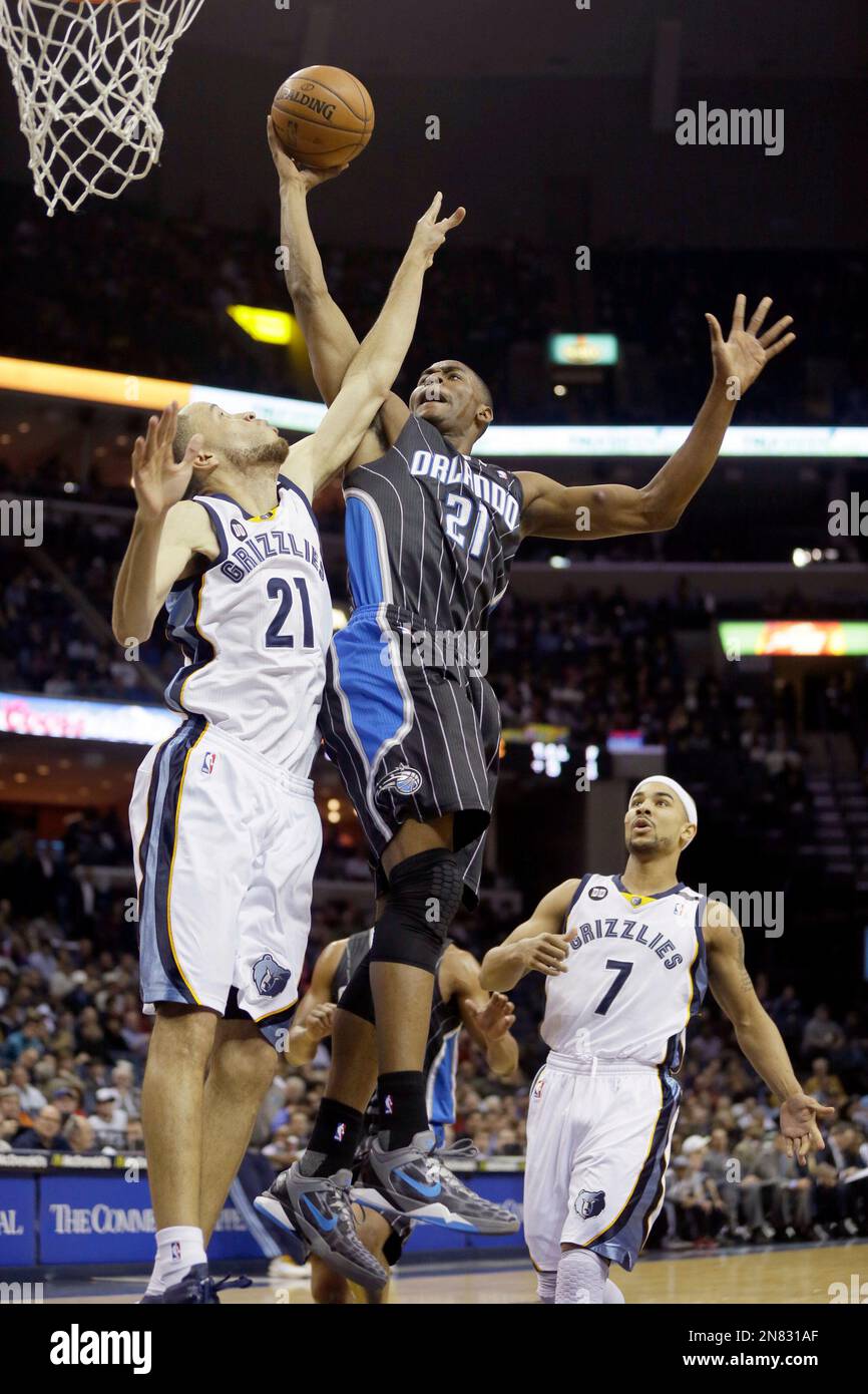 Orlando Magic's Moe Harkless, center goes to the basket over Memphis ...