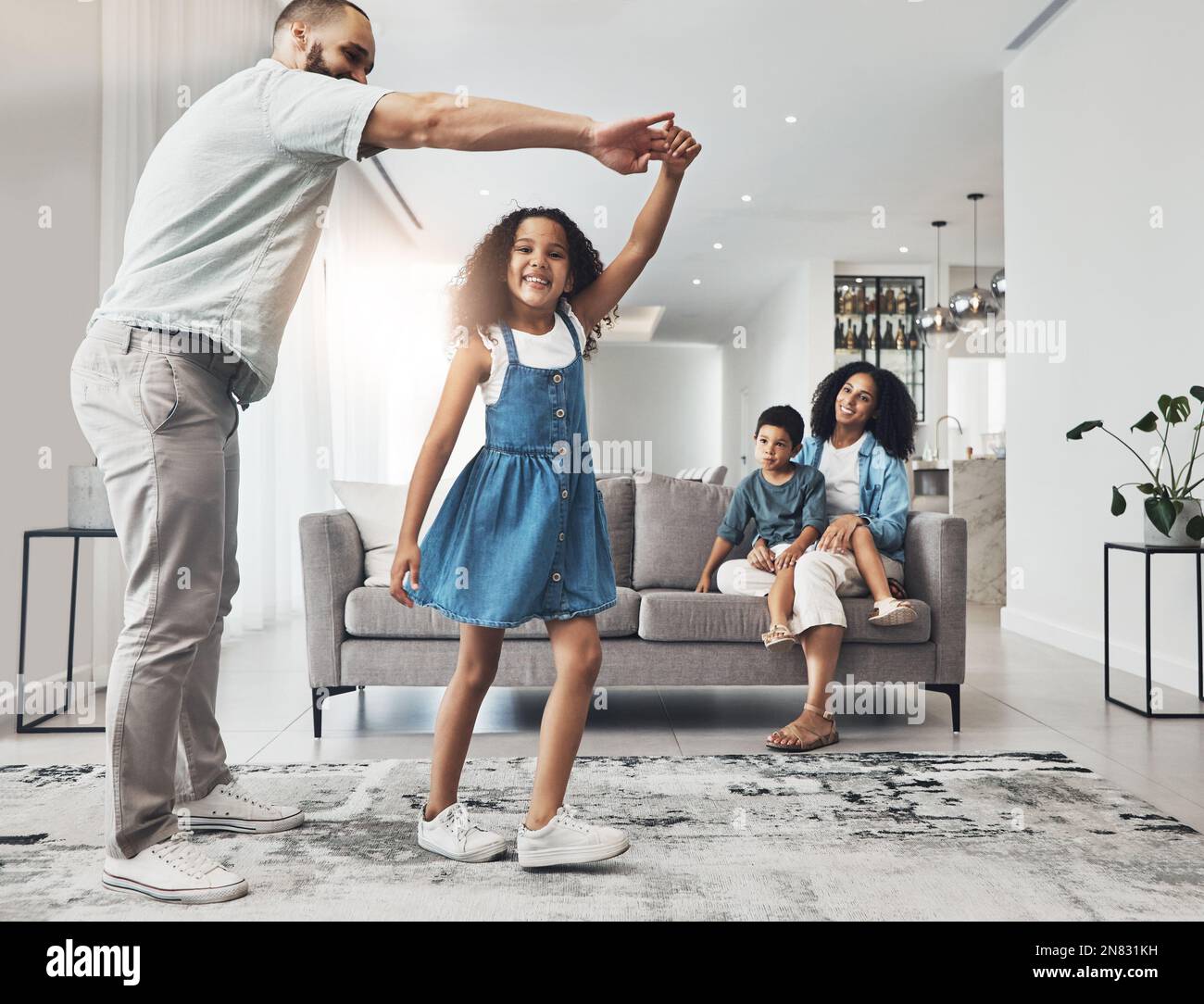 Happy family, dance and music in a living room by girl and father ...