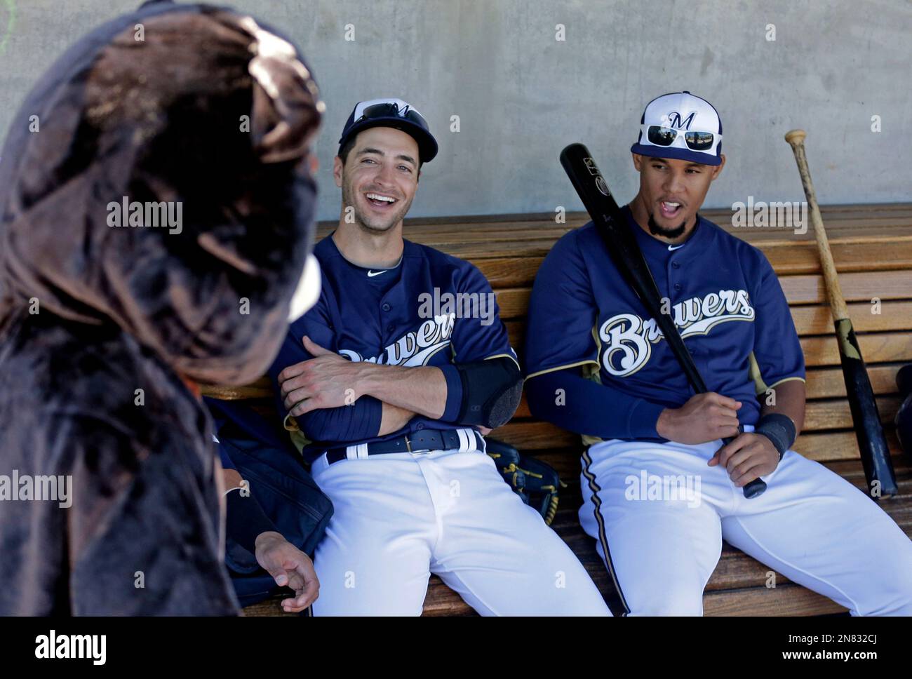 Milwaukee Brewers' Ryan Braun, left, and Carlos Gomez smile as teammate ...