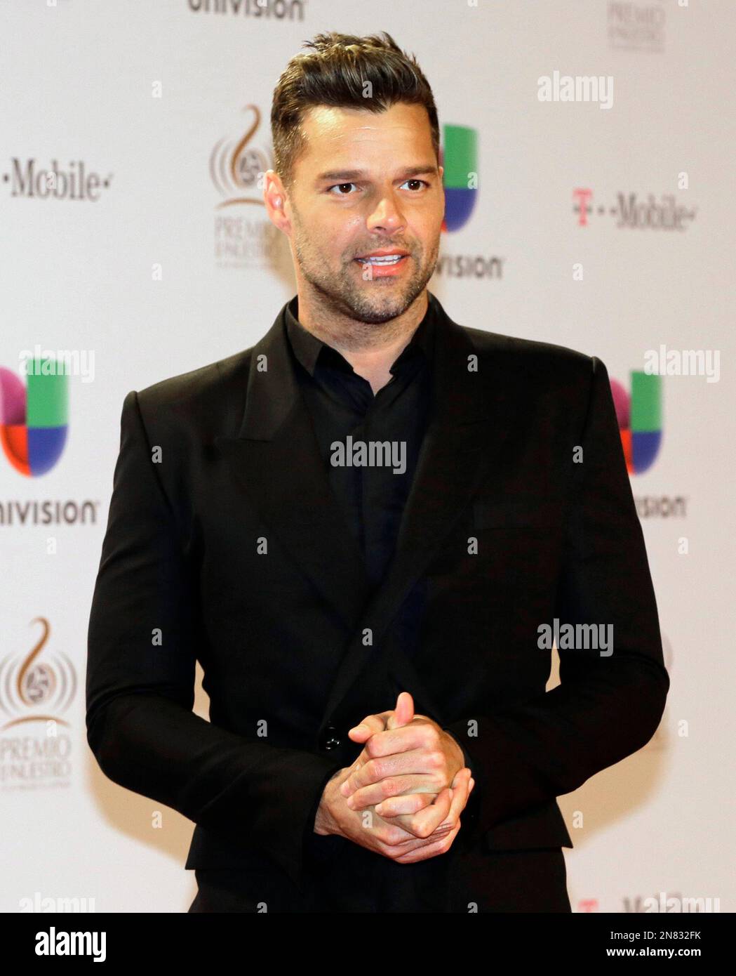 Puerto Rican singer Ricky Martin poses for photographers on the red ...