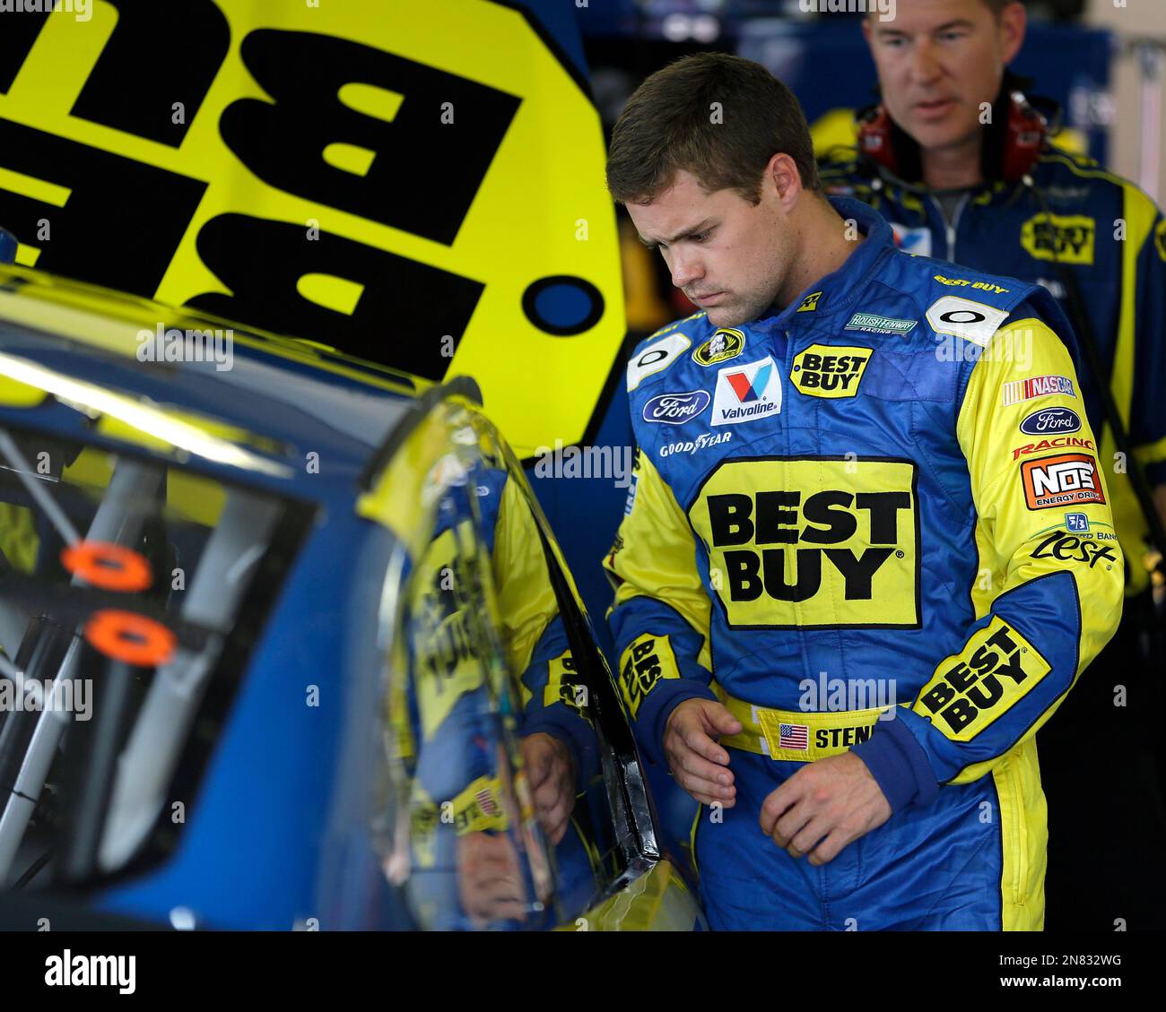 Ricky Stenhouse Jr. looks over his car in his garage during a practice ...